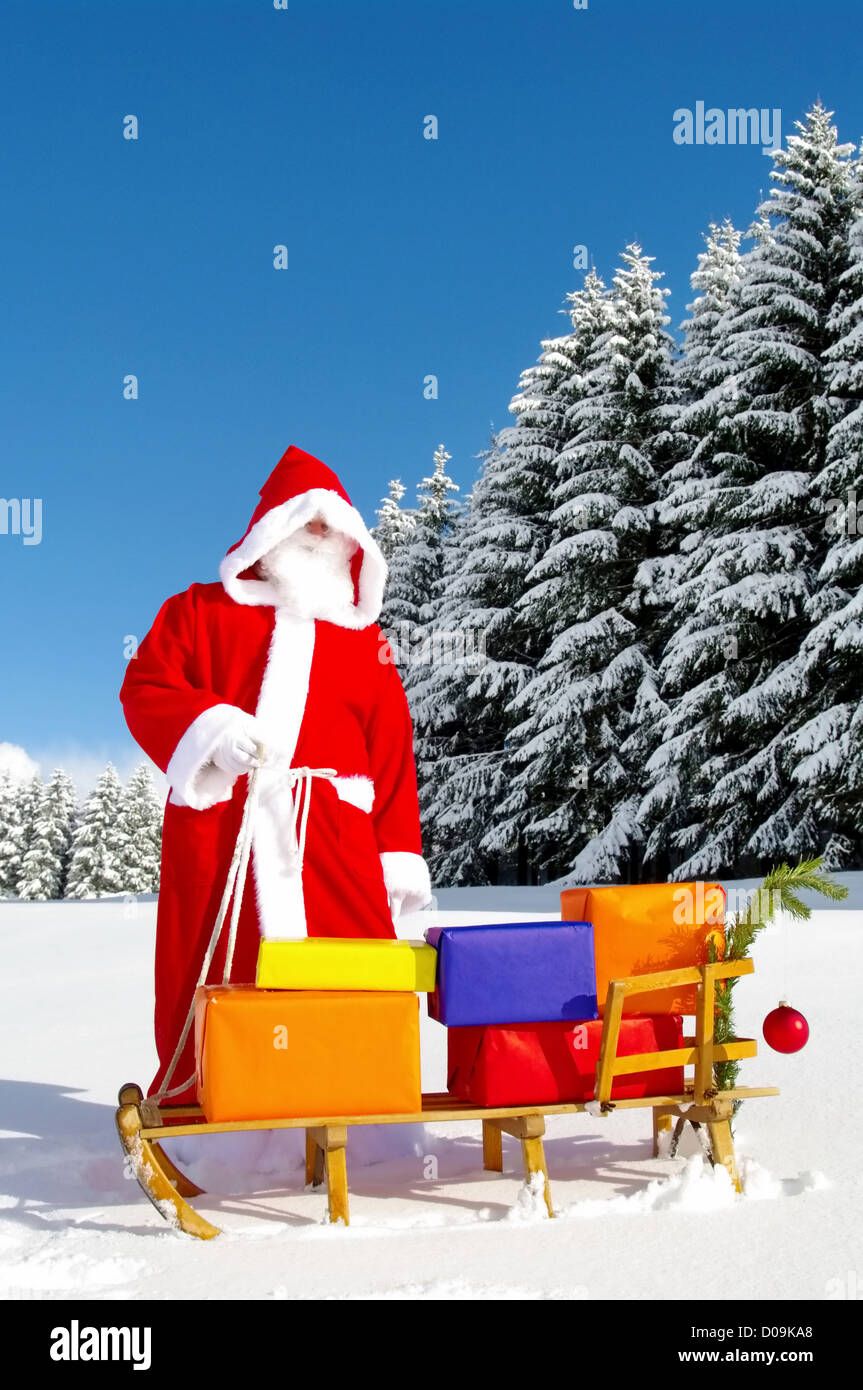 Santa Claus, Father Christmas with colorful presents on a sledge Stock ...