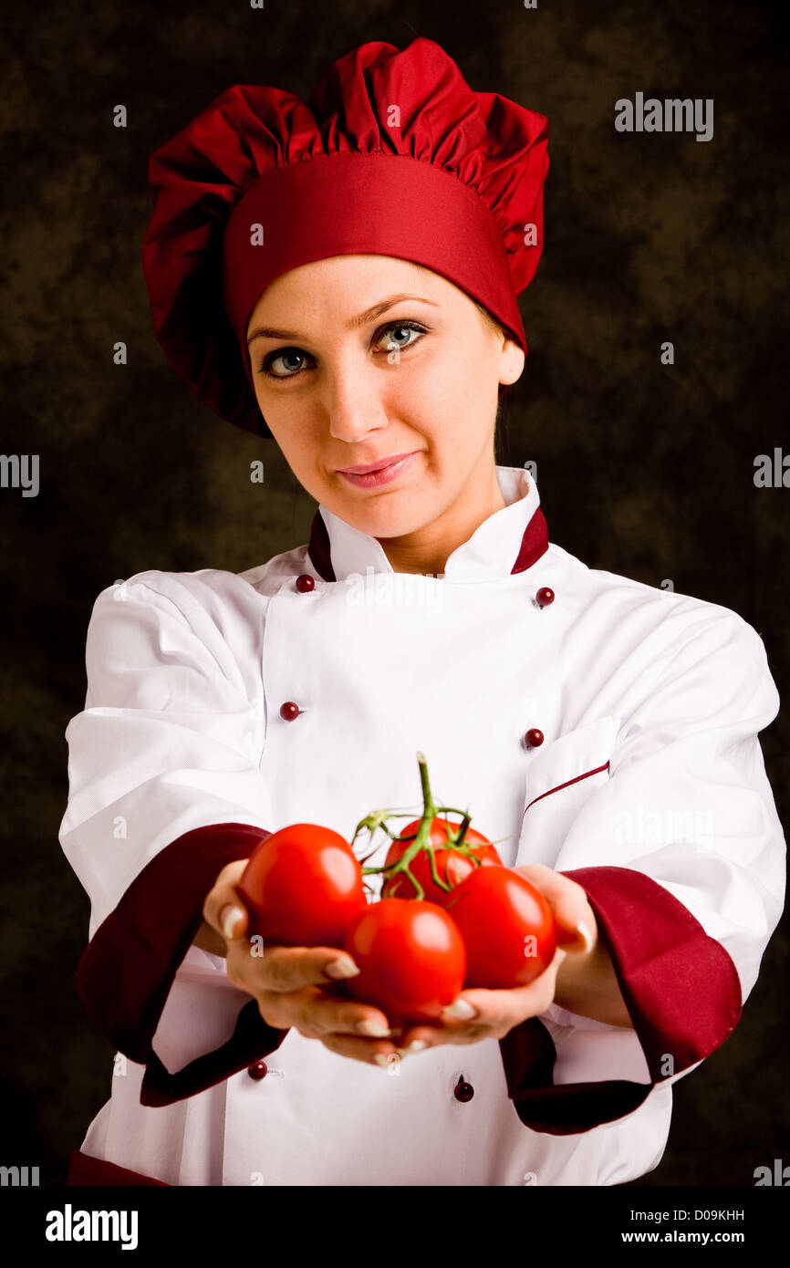 portrait photo of young female chef in front of rural background Stock ...