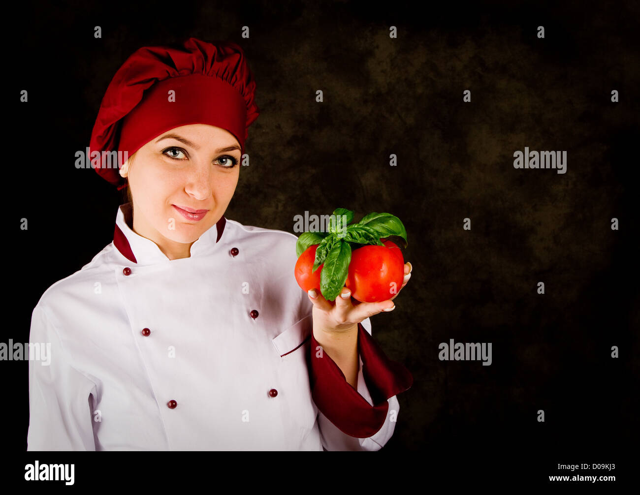 portrait photo of young female chef in front of rural background Stock ...