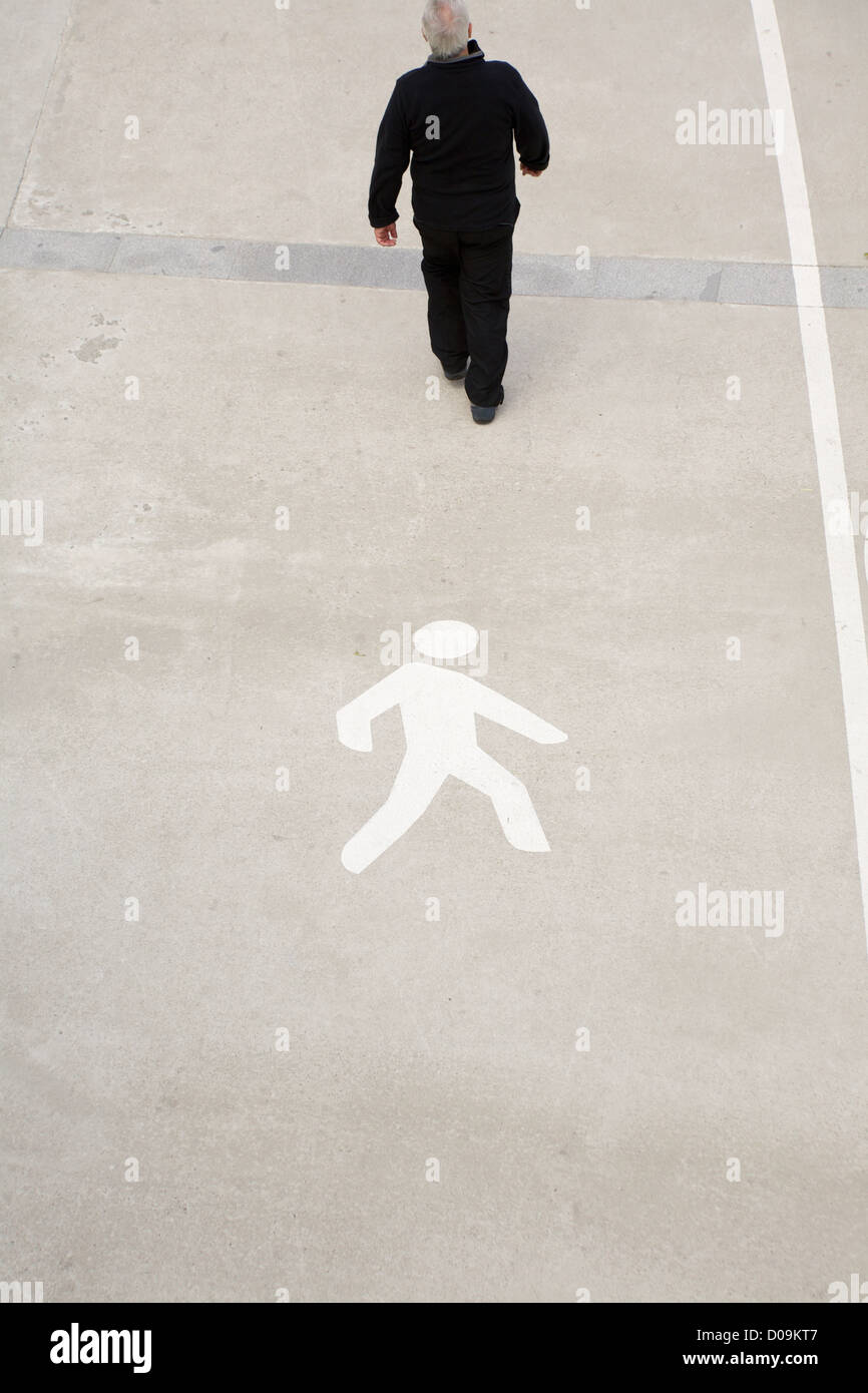 pedestrian lane sign on the asphalt ground Stock Photo - Alamy