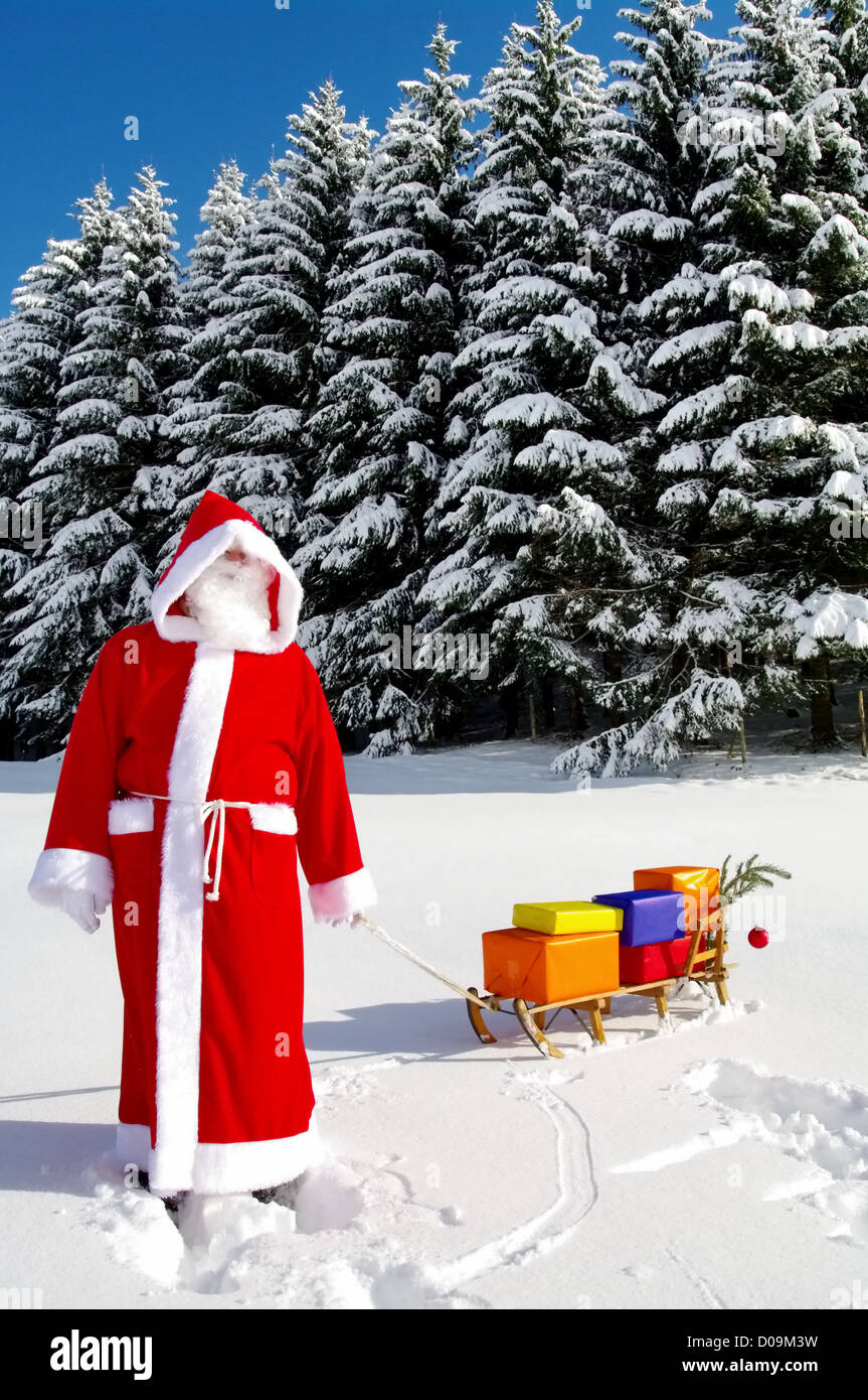 Santa Claus, Father Christmas with colorful presents on a sledge Stock ...