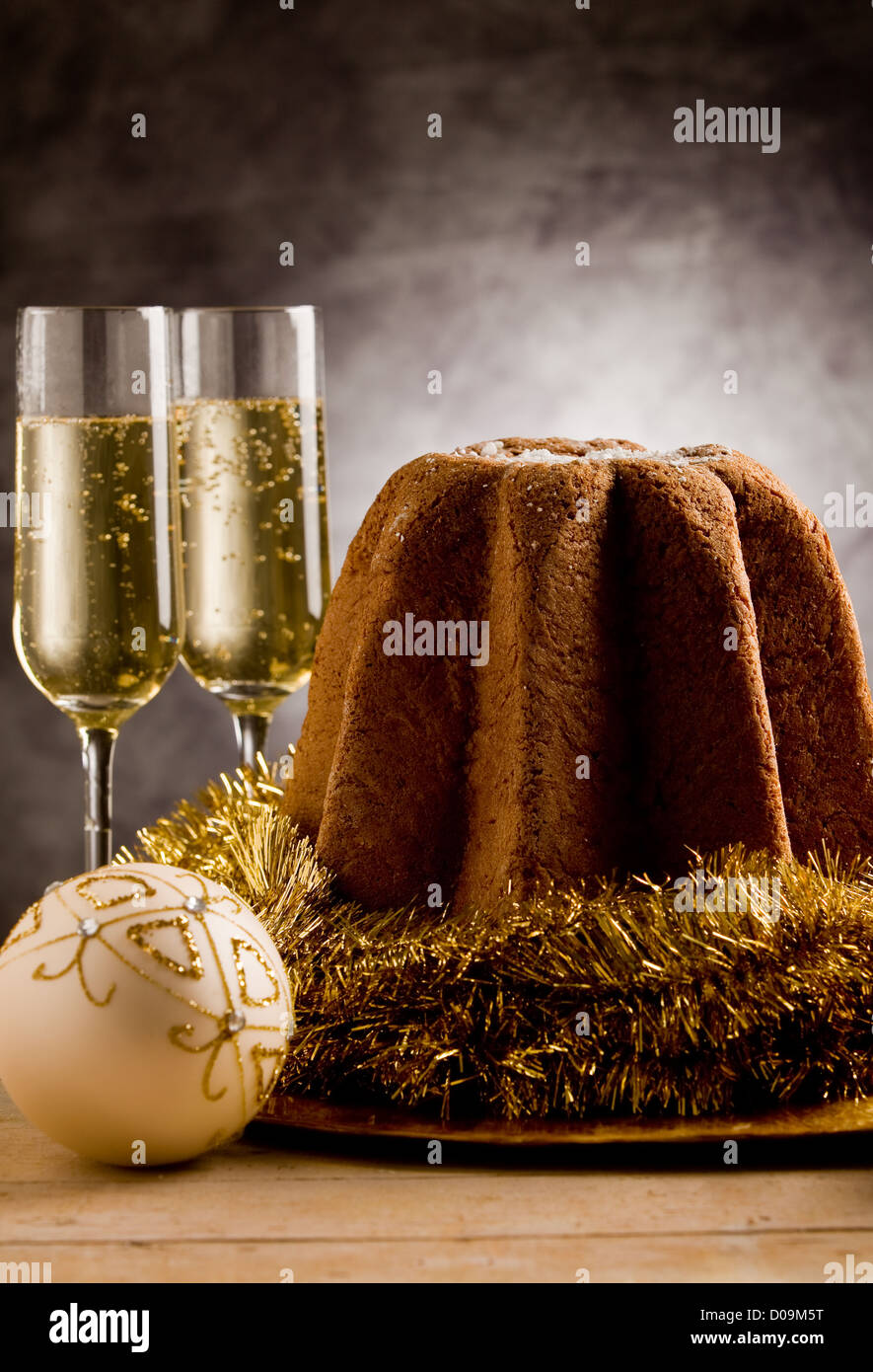 photo of delicious italian christmas panettone cake with champagne ...