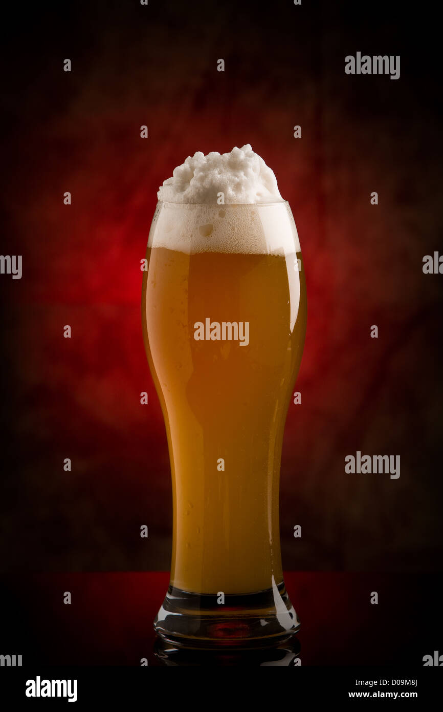 photo of cold delicious beer in front of a rural background Stock Photo ...