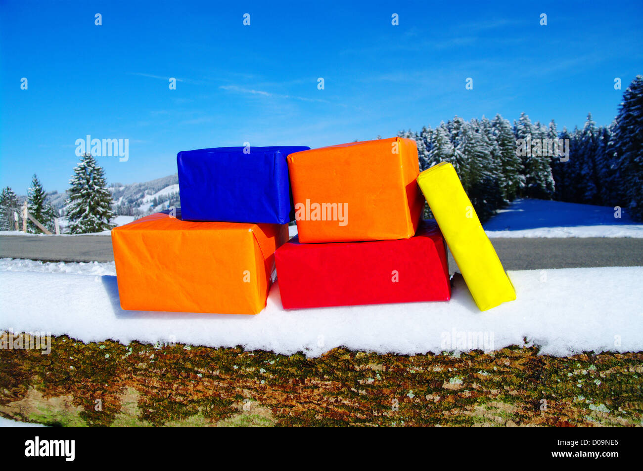 present parcels outside in a snowy landscape Stock Photo - Alamy