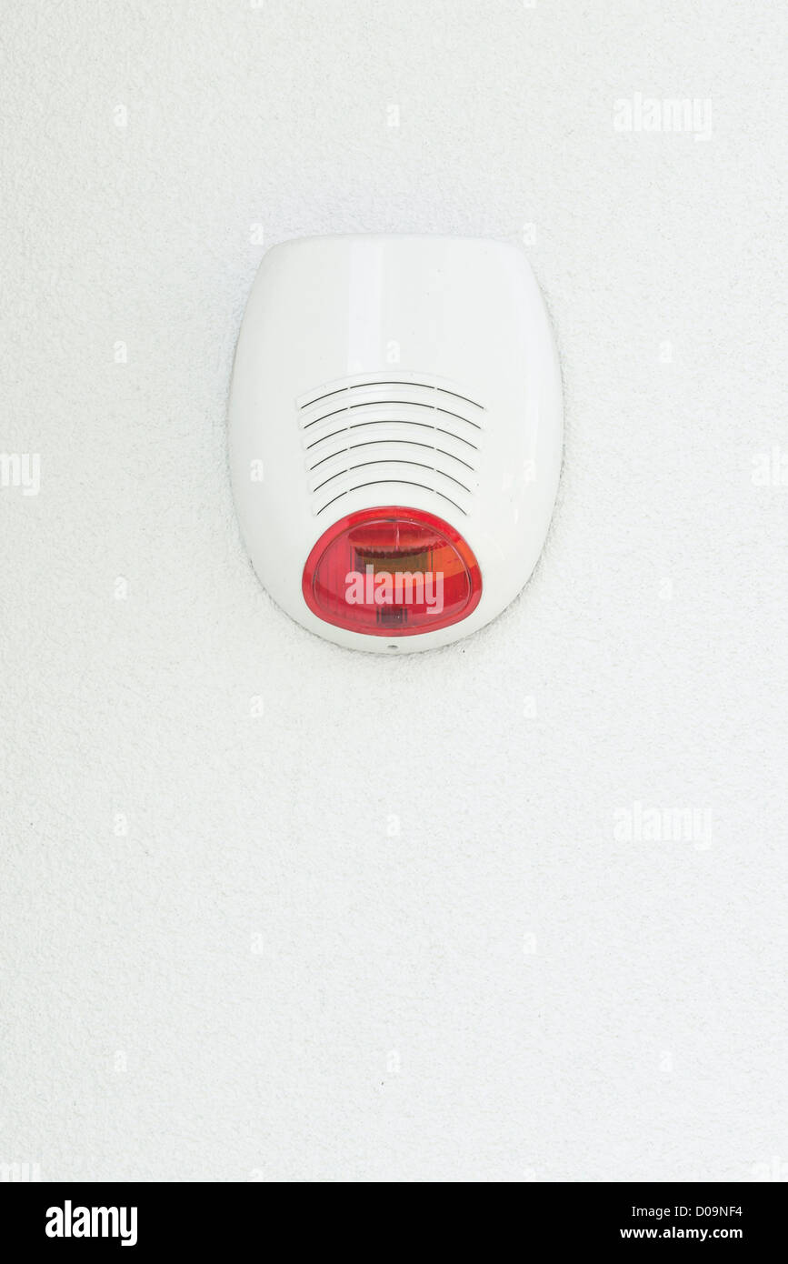 Alarm device on a white wall Stock Photo - Alamy