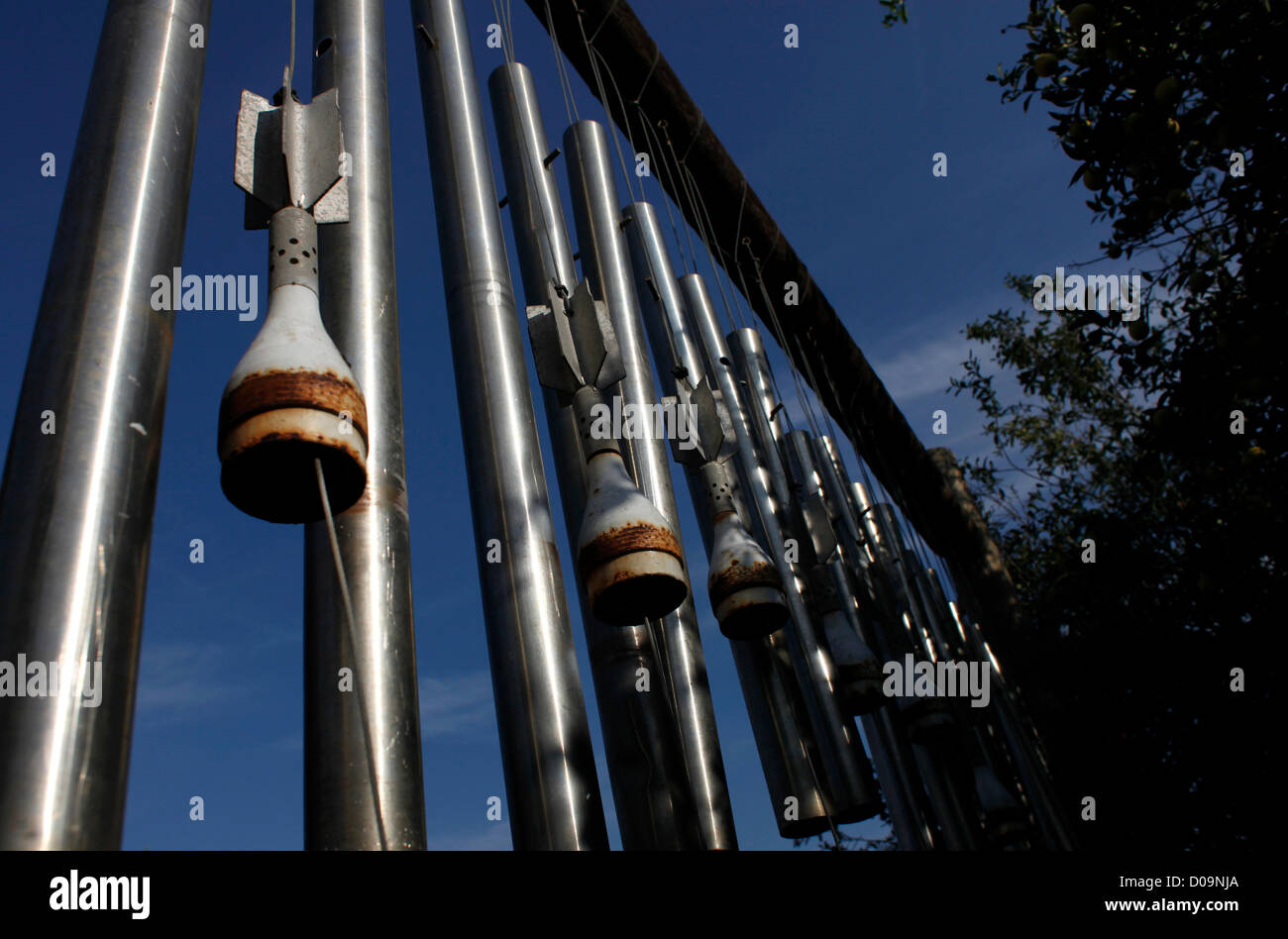 A wind chime made of remnants of exploded mortar shells that were fired ...