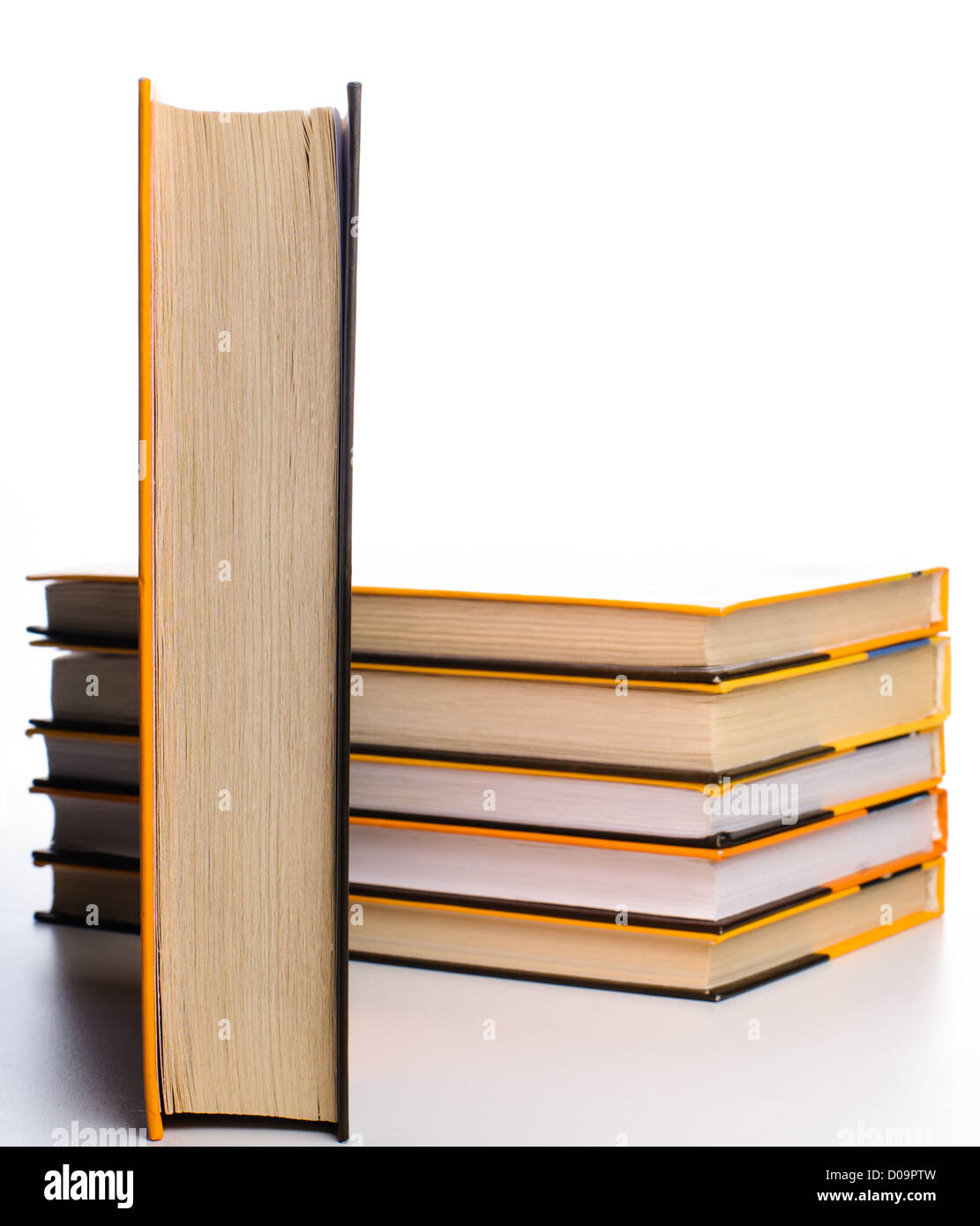 Big stack of yellow books isolated on white background Stock Photo - Alamy