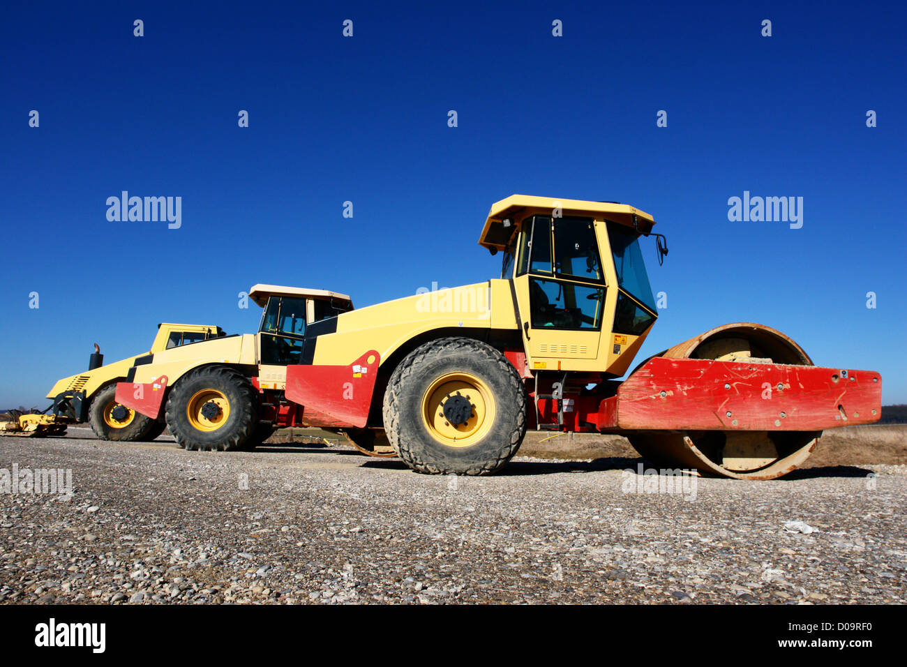 excavator on a building site on a sunny day Stock Photo - Alamy