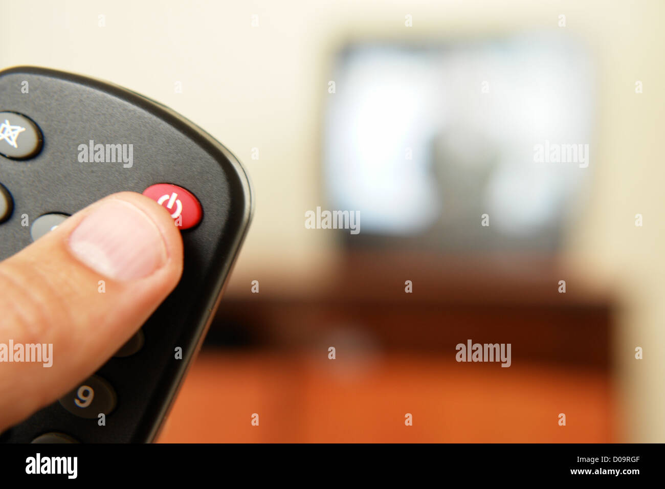 Television screen with tv remote control in foreground Stock Photo - Alamy