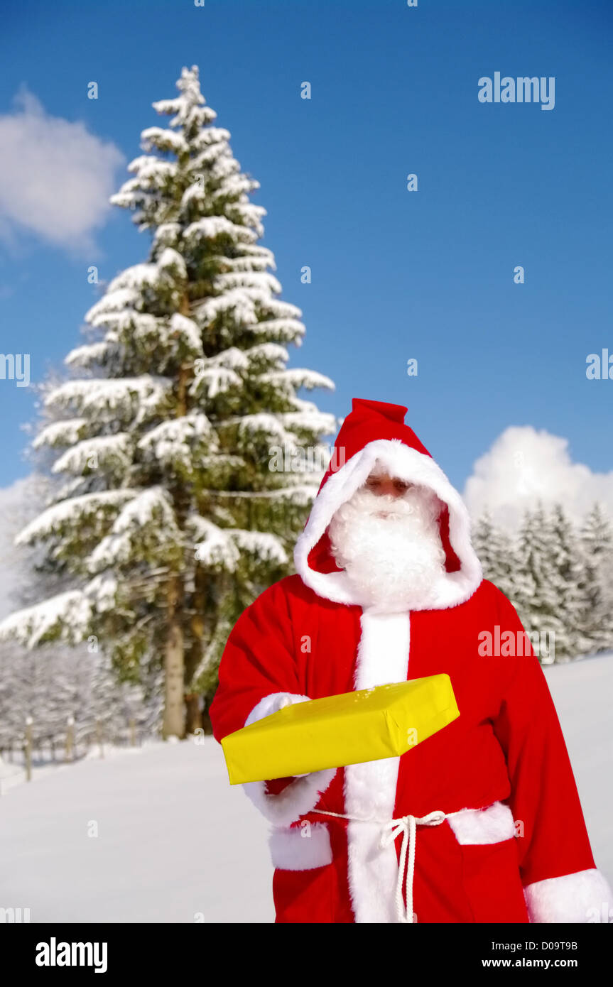 Santa Claus, Father Christmas delivers presenting present Stock Photo ...