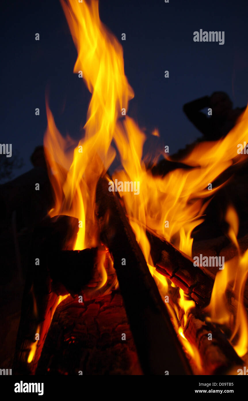 a nice campfire burning outside in summer Stock Photo - Alamy