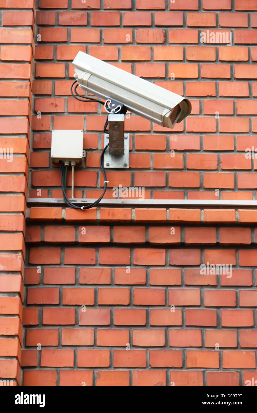 surveillance security camera on wall Stock Photo - Alamy