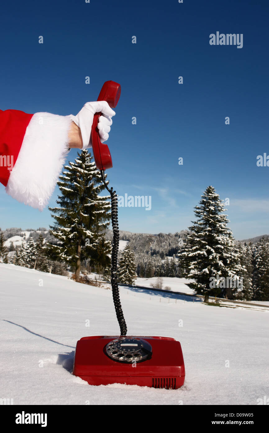 Santa Claus Hotline symbolized by a red retro phone Stock Photo - Alamy