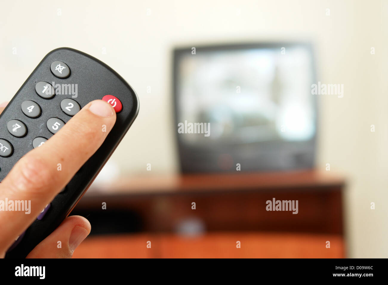 Television screen with tv remote control in foreground Stock Photo - Alamy