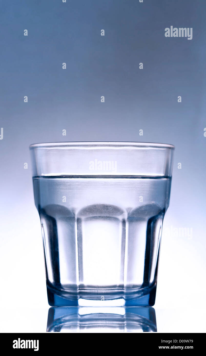 Close-up photograph of a glass of water on a gradient backgroung Stock ...