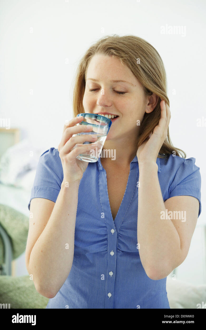 WOMAN WITH COLD DRINK Stock Photo - Alamy
