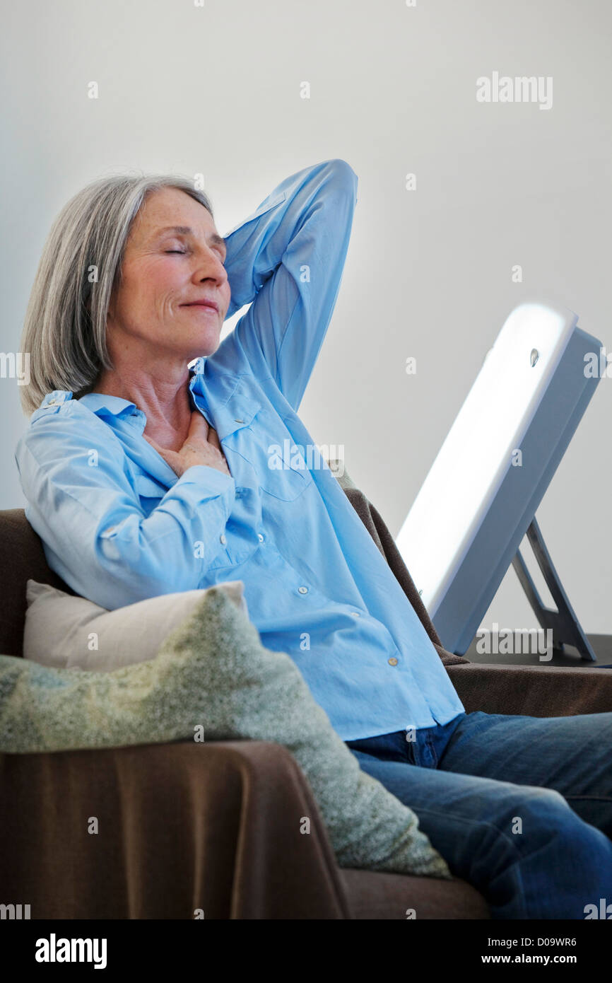 ELDERLY PERSON LIGHT THERAPY Stock Photo - Alamy