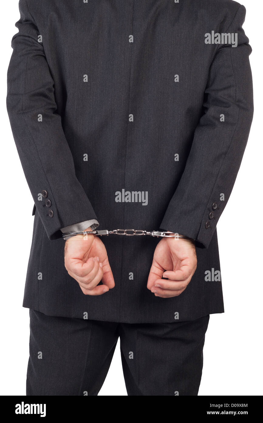 business man with a black suit in handcuffs isolated on white, back ...