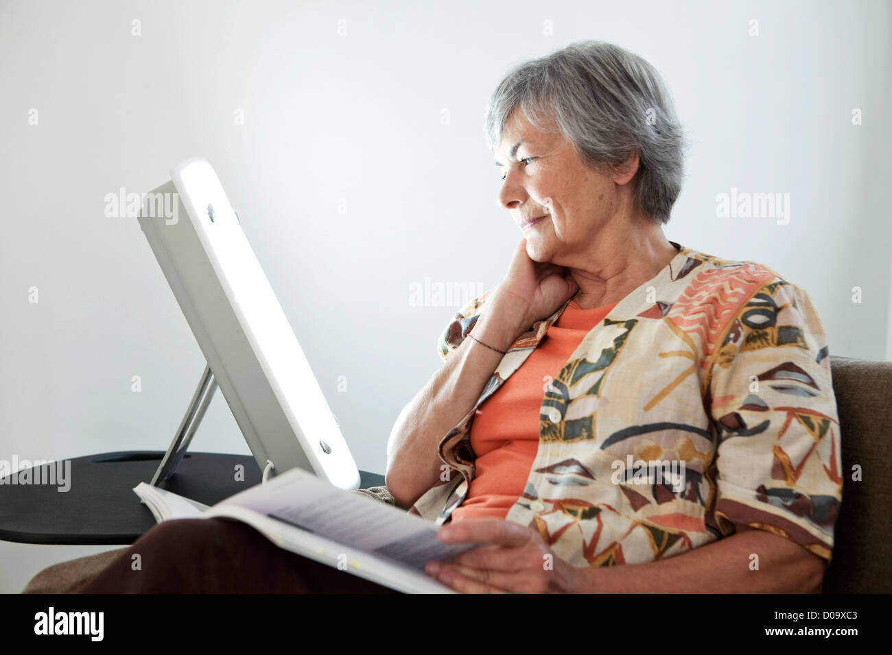 ELDERLY PERSON LIGHT THERAPY Stock Photo - Alamy