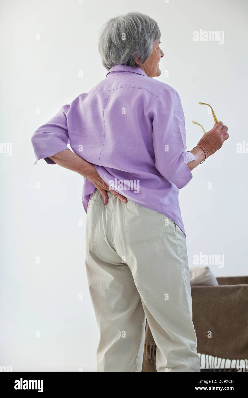 Lower back pain in elderly hi-res stock photography and images - Alamy