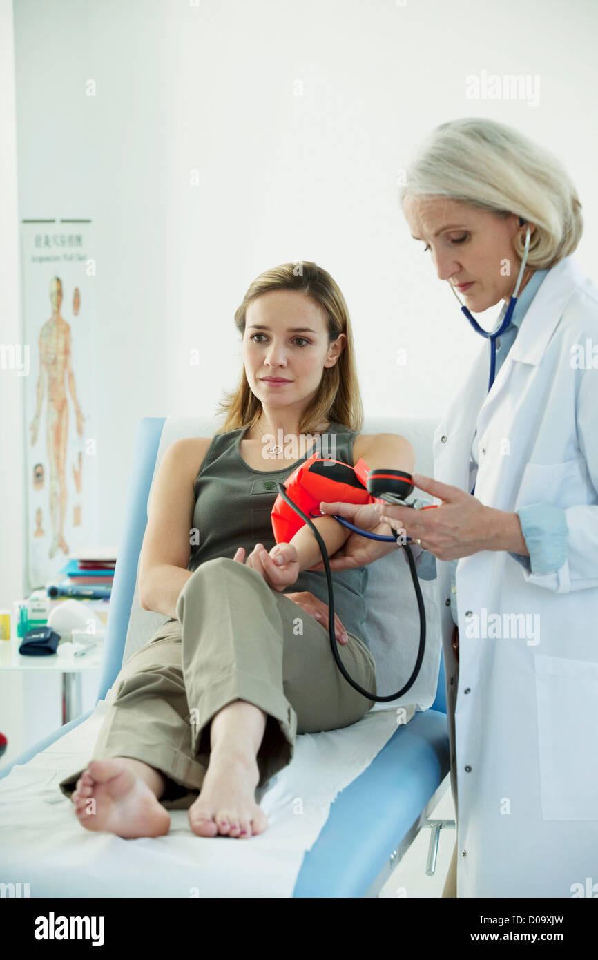 BLOOD PRESSURE, WOMAN Stock Photo - Alamy