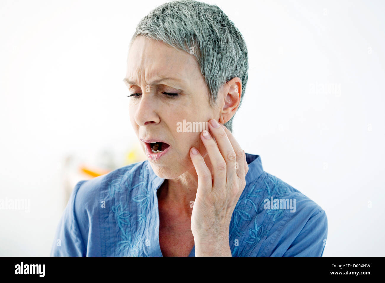 ELDERLY PERSON WITH A TOOTHACHE Stock Photo - Alamy