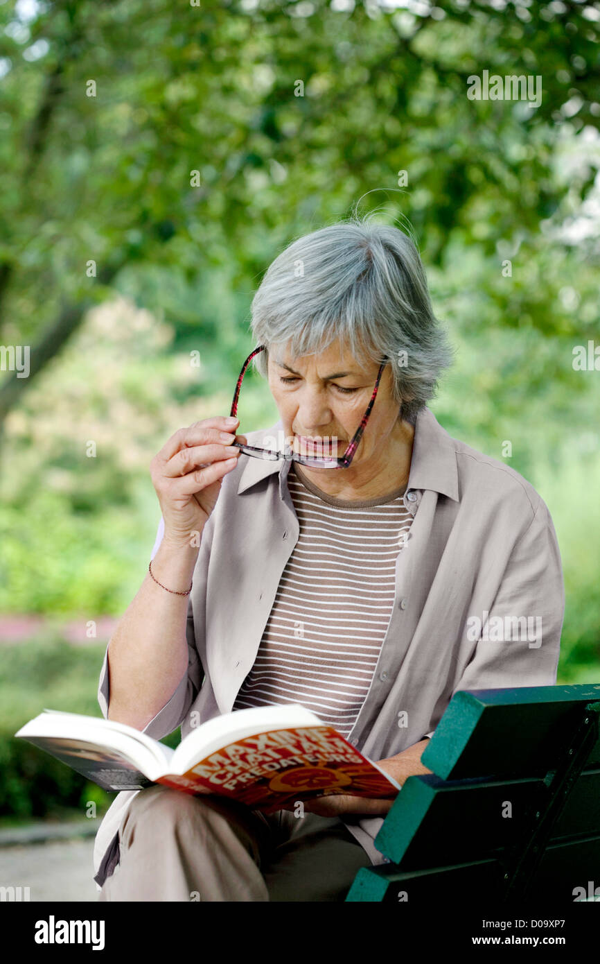 ELDERLY PERSON READING Stock Photo - Alamy