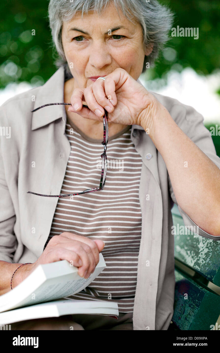 ELDERLY PERSON READING Stock Photo - Alamy