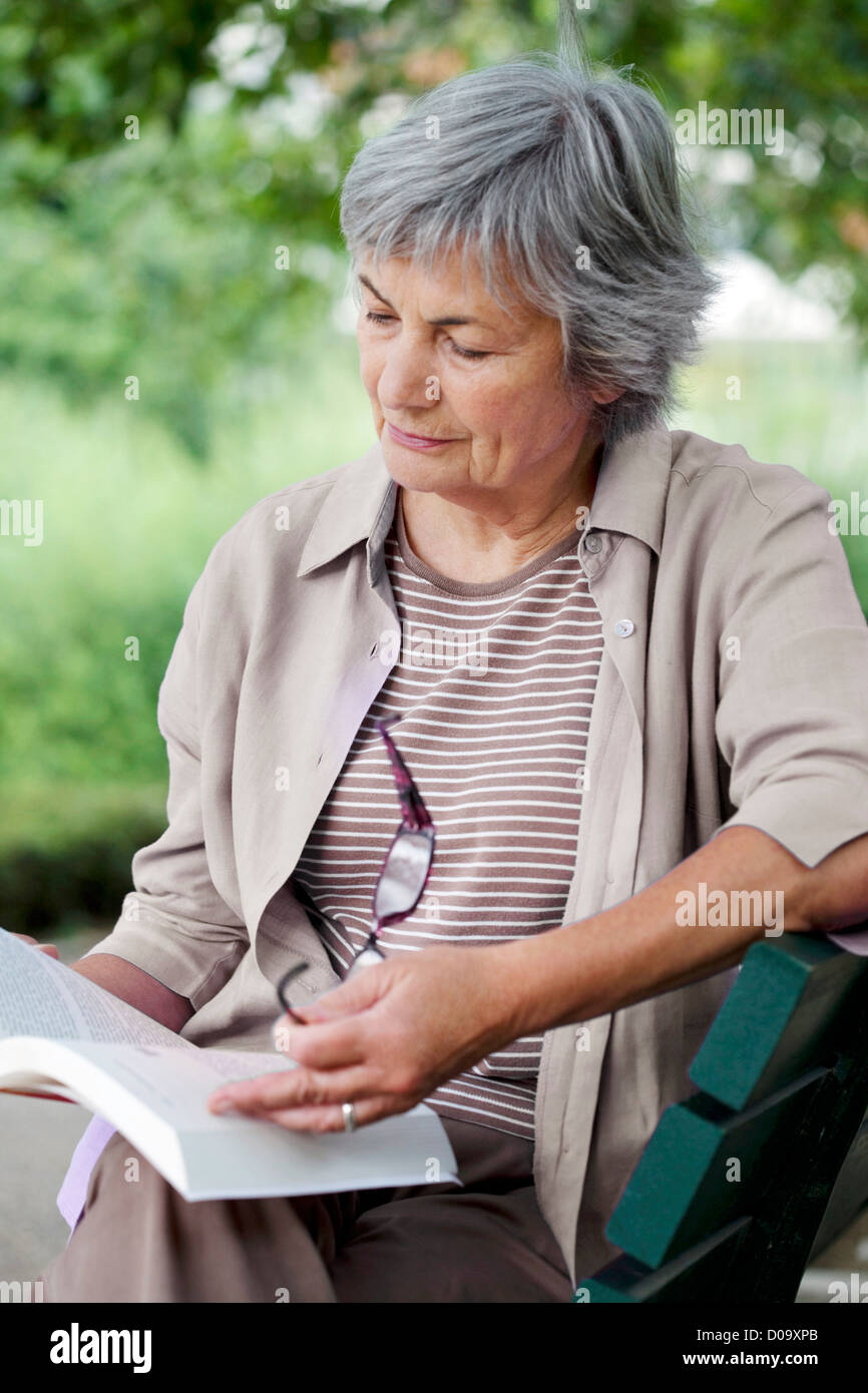 ELDERLY PERSON READING Stock Photo - Alamy