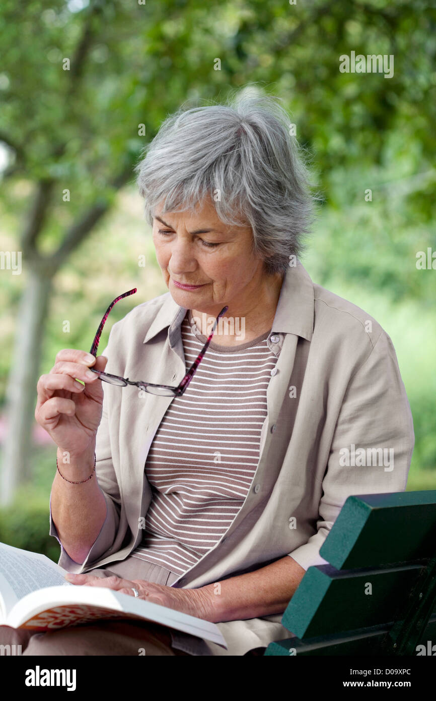 ELDERLY PERSON READING Stock Photo - Alamy