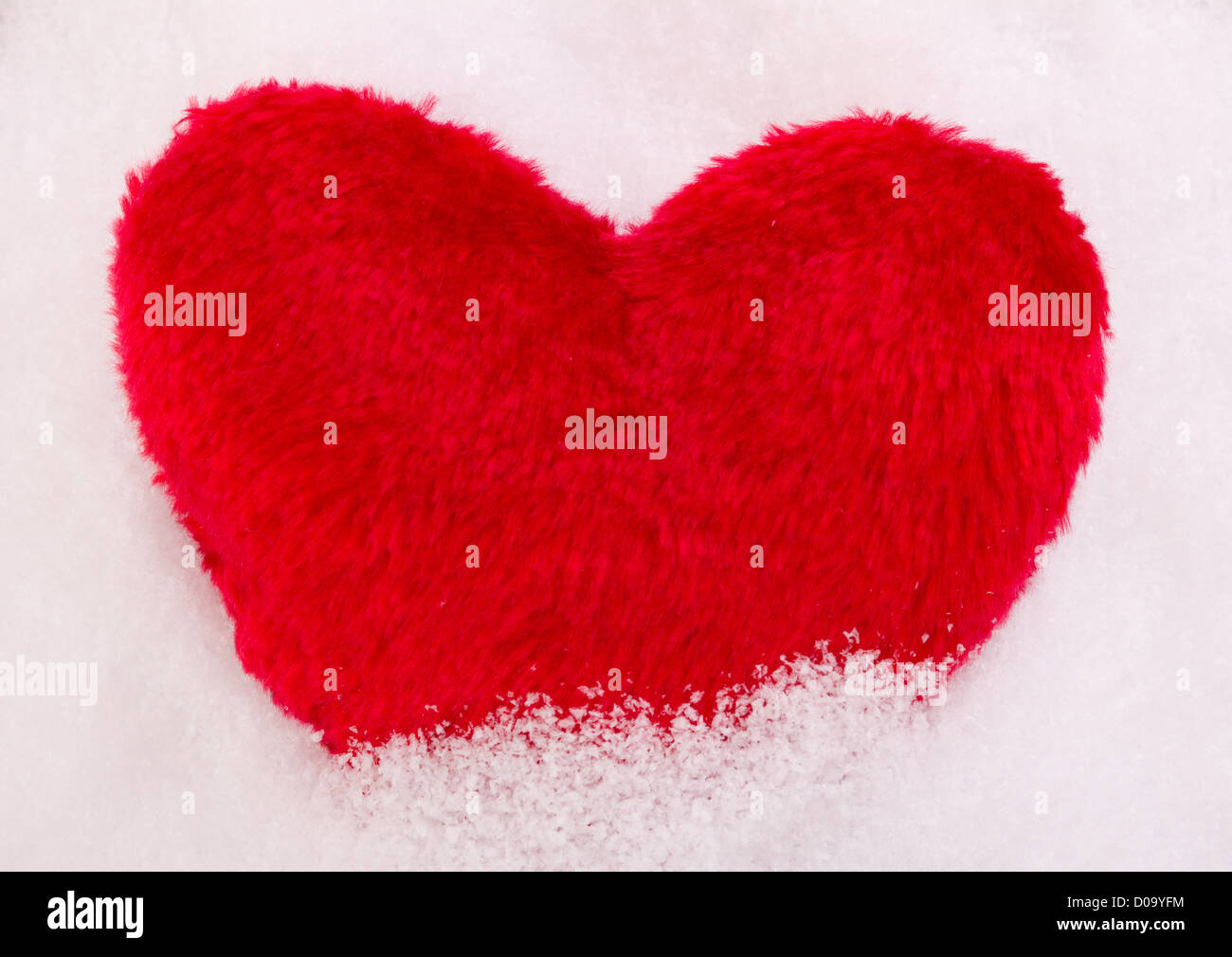 Red heart in snow Stock Photo - Alamy