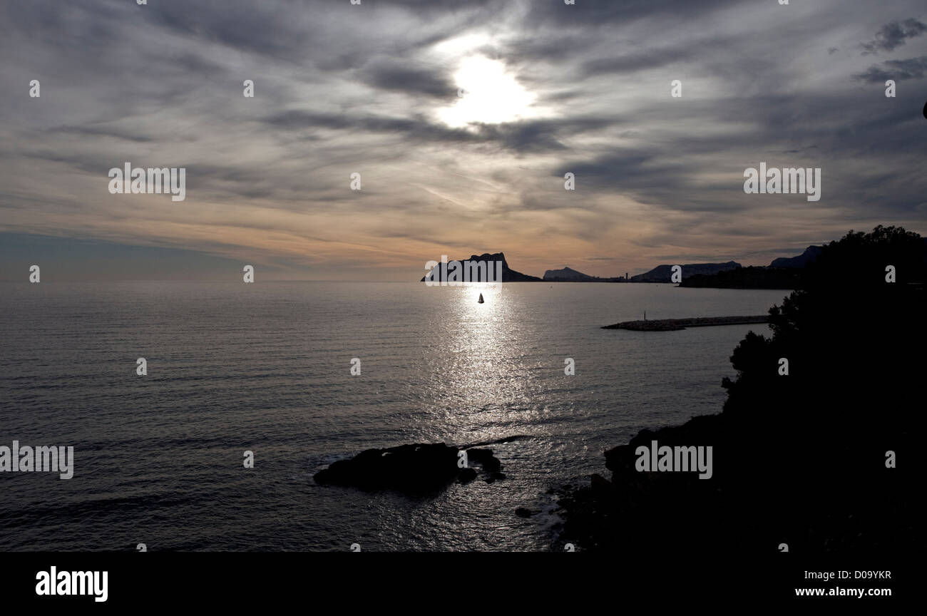 sunset and sky over the rock of calpe (Peñon d'Ifach), costa blanca ...