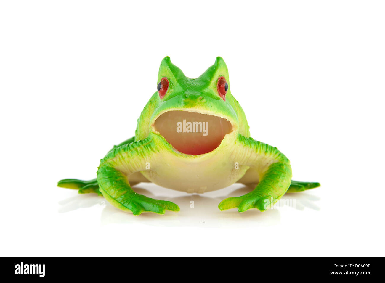Plastic green frog toy over white background Stock Photo - Alamy