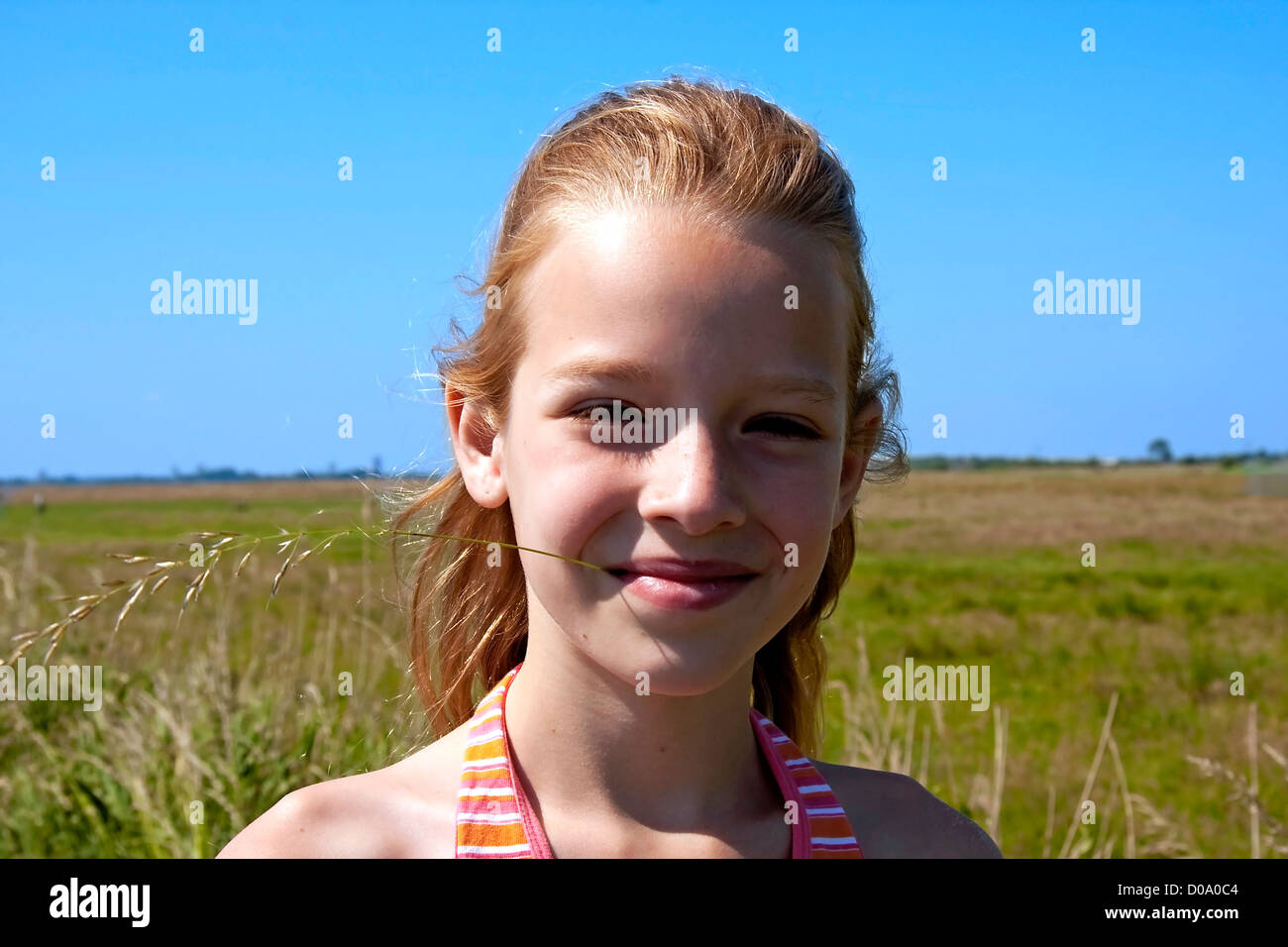 portrait of a young girl looking in camera on sunny day Stock Photo - Alamy