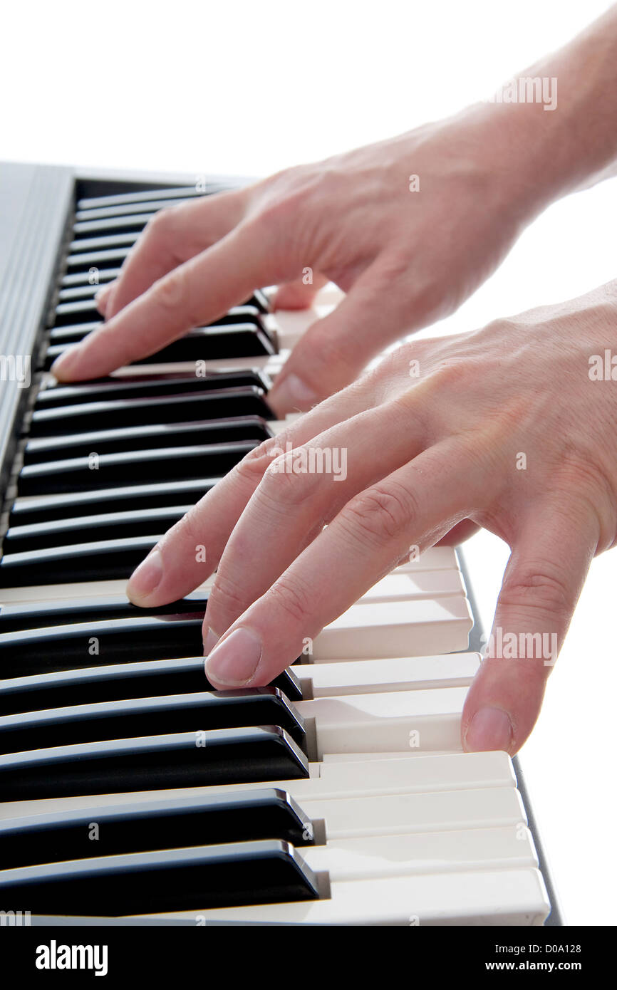 Hands are playing the piano over white background Stock Photo - Alamy