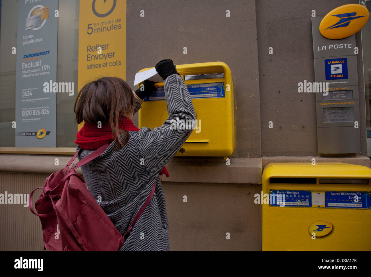 Woman posting letter in post hi-res stock photography and images - Alamy