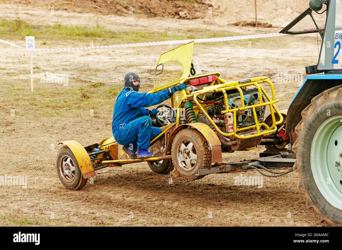 The tractor tows on parking broken racing buggy. Episode 4 Stock Photo ...
