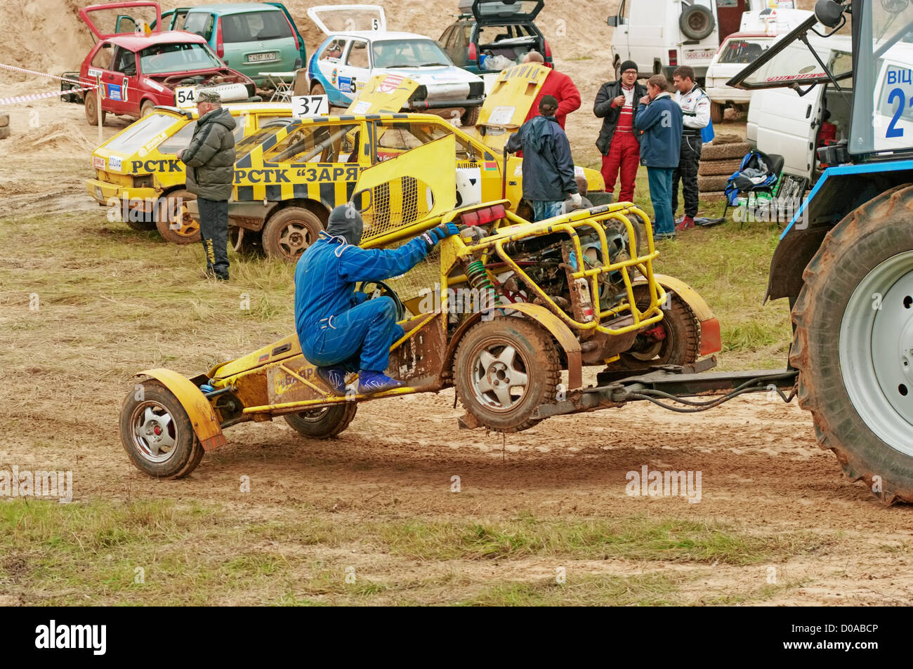 The tractor tows on parking broken racing buggy. Episode 6 Stock Photo ...