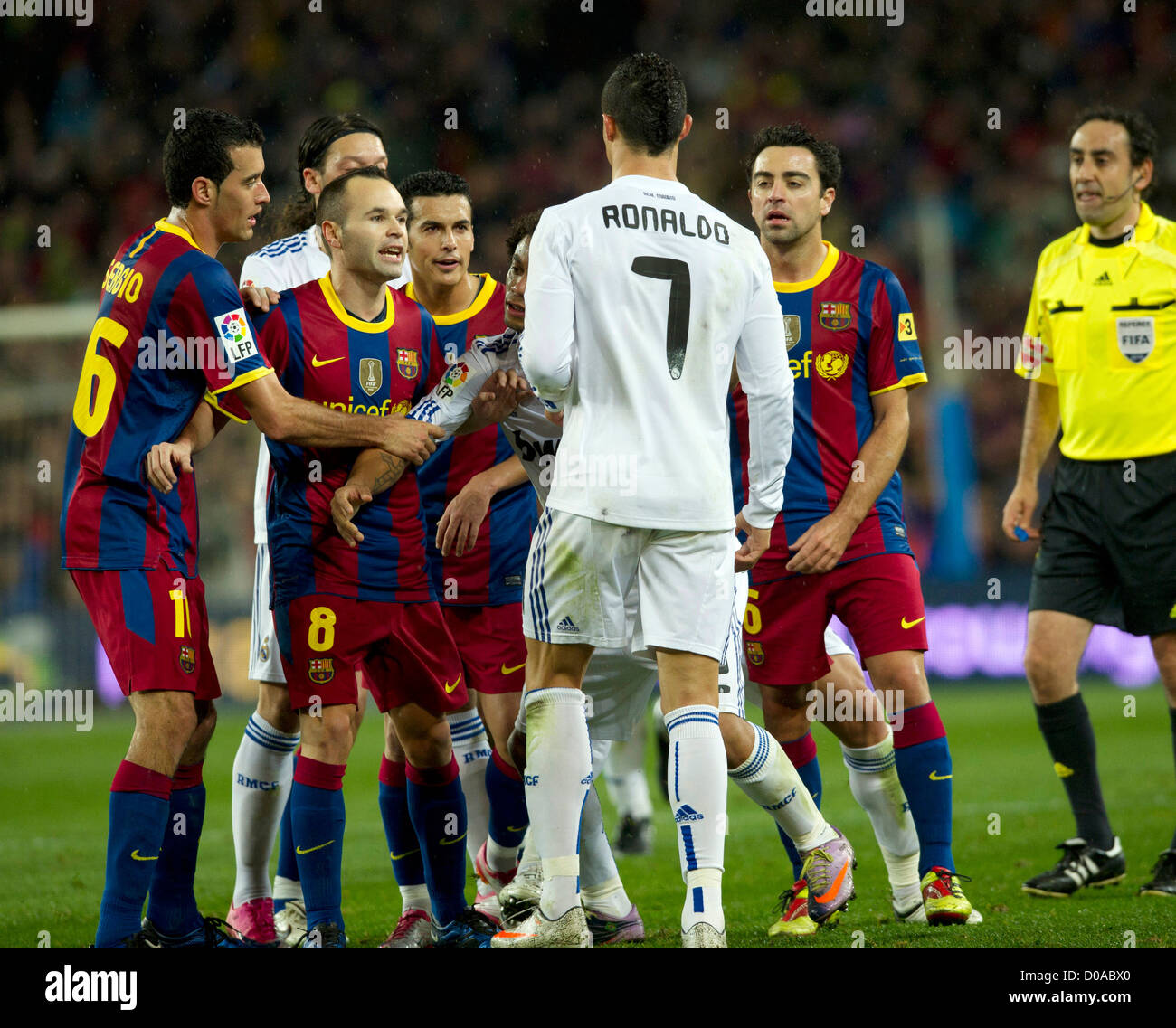 Barcelona's Andres Iniesta and Xavi Hernandez and Real Madrid's Cristia ...