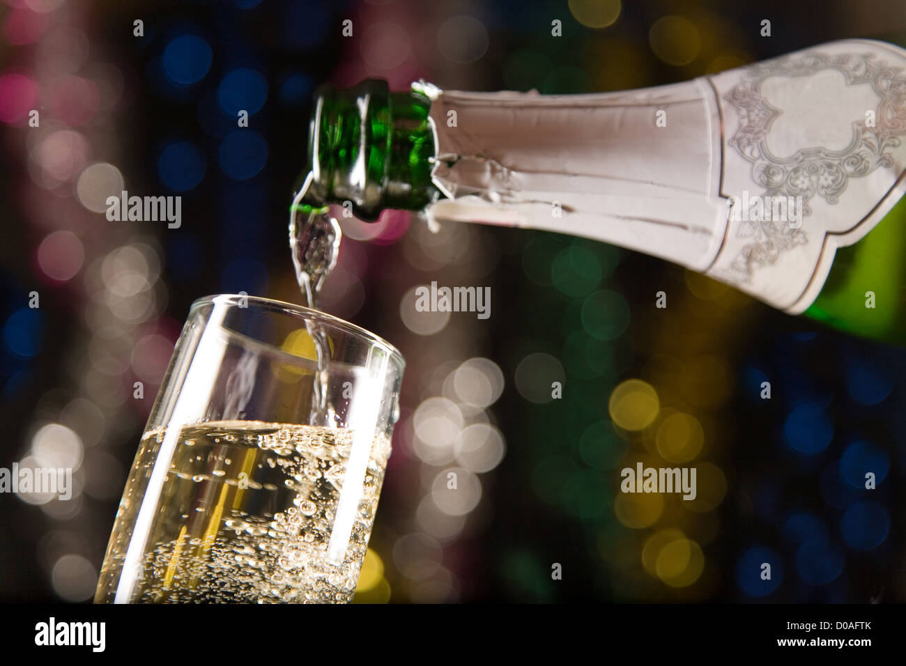 New Year card with champagne flowing in the glass Stock Photo - Alamy