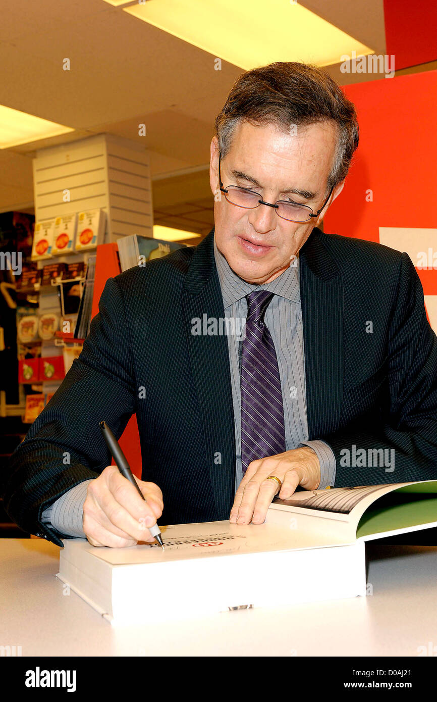 Garry B.Trudeau signs the new essential anthology for one of the ...