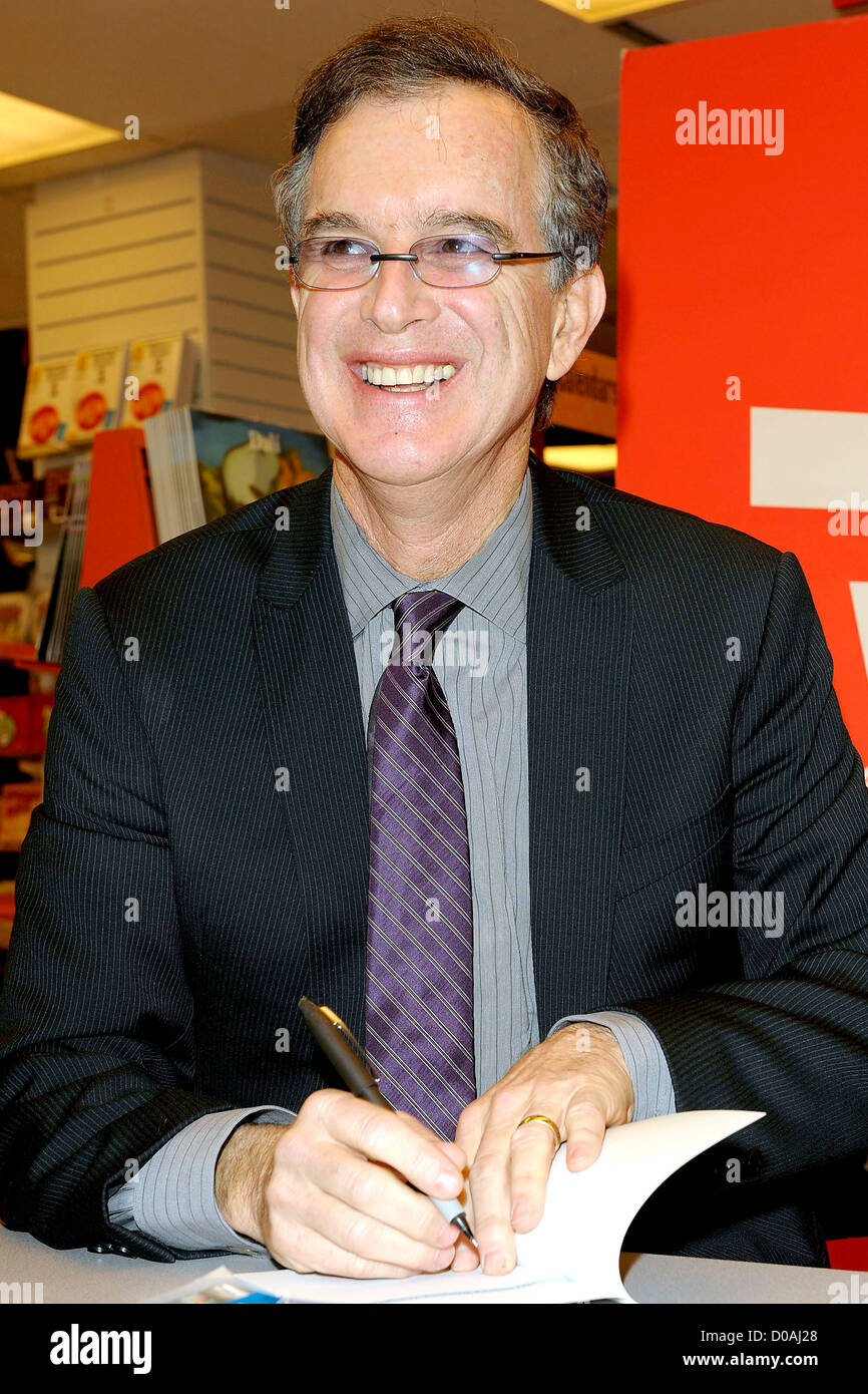 Garry B.Trudeau signs the new essential anthology for one of the ...