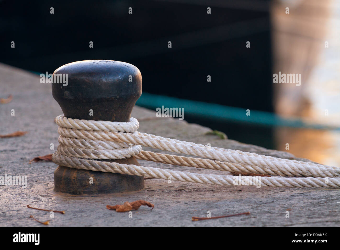 Ship rope tied to a harbor, horizontal shot Stock Photo - Alamy