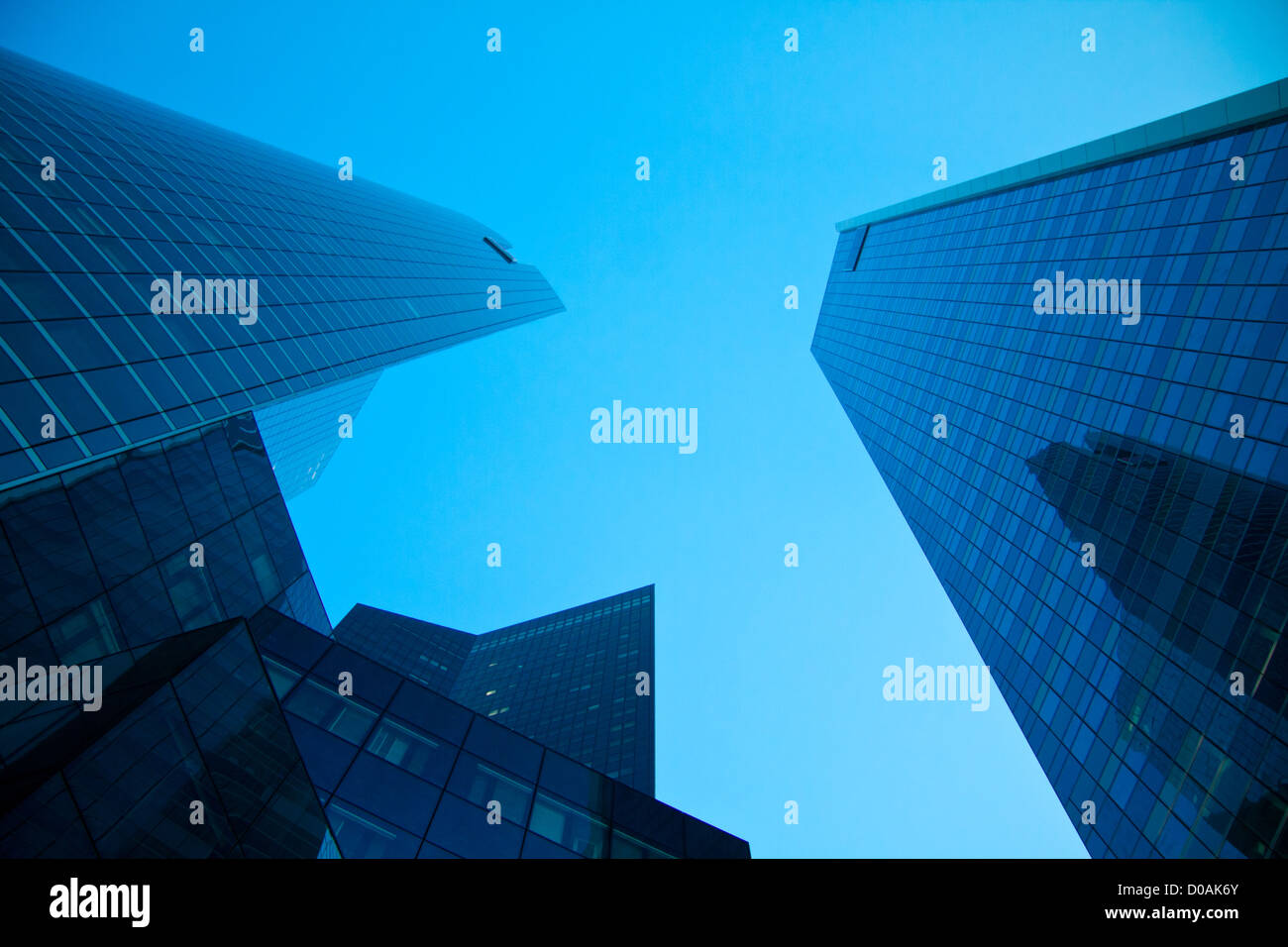 Skyscrapers and blue sky view from below Stock Photo - Alamy