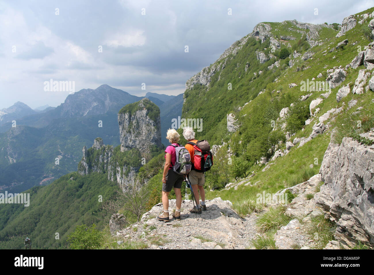 walkers on a path in the Apuan Alps - Alpi Apuane in Tuscany. Procinto ...