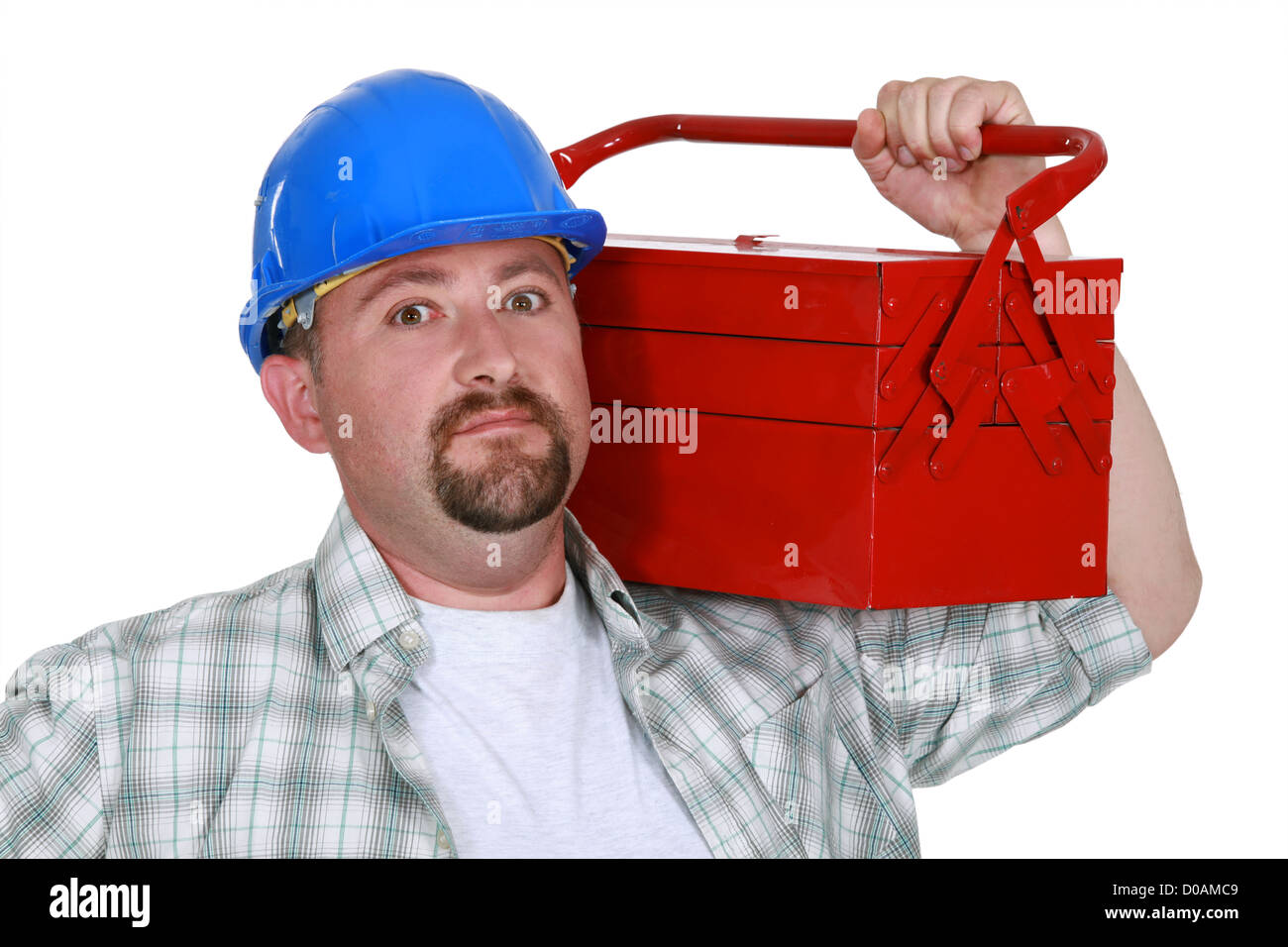 Worker holding too-box over shoulder Stock Photo - Alamy