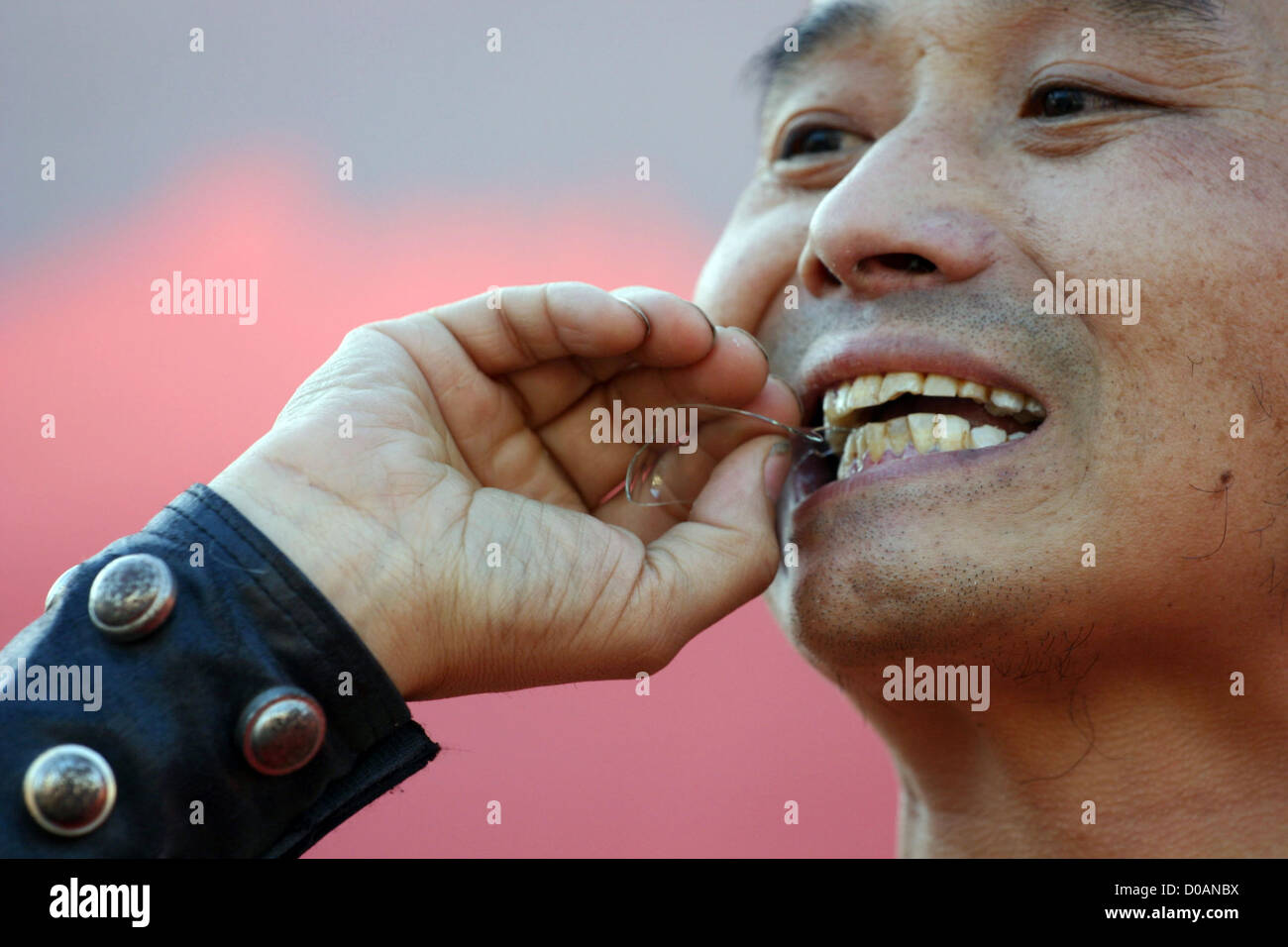 A man eats glass during a Superman Competition in Xi'an of Shanxi ...