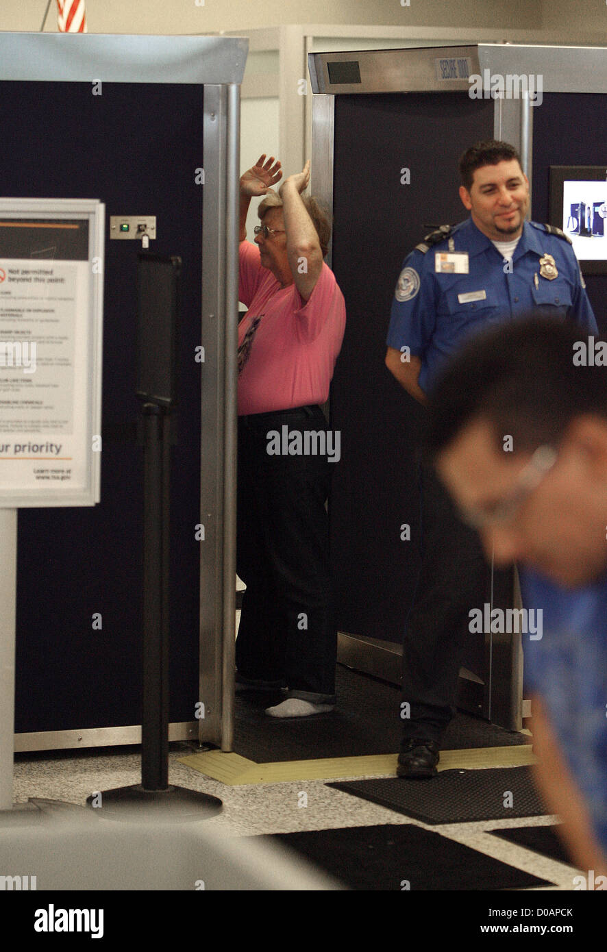 Holiday travelers submit to TSA's full body scan at the Corpus Christi ...