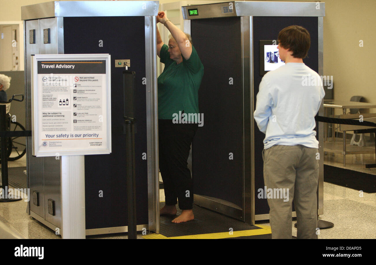 Holiday travelers submit to TSA's full body scan at the Corpus Christi ...