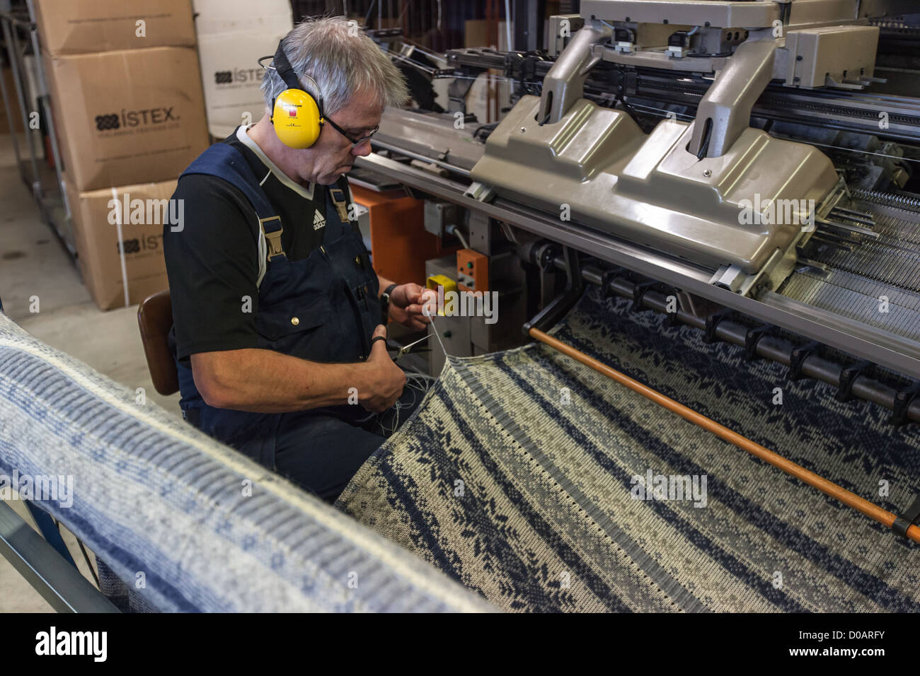 MAN WORKING IN THE WORKSHOP OF AN ICELANDIC PULLOVER FACTORY KIDKA THE ...